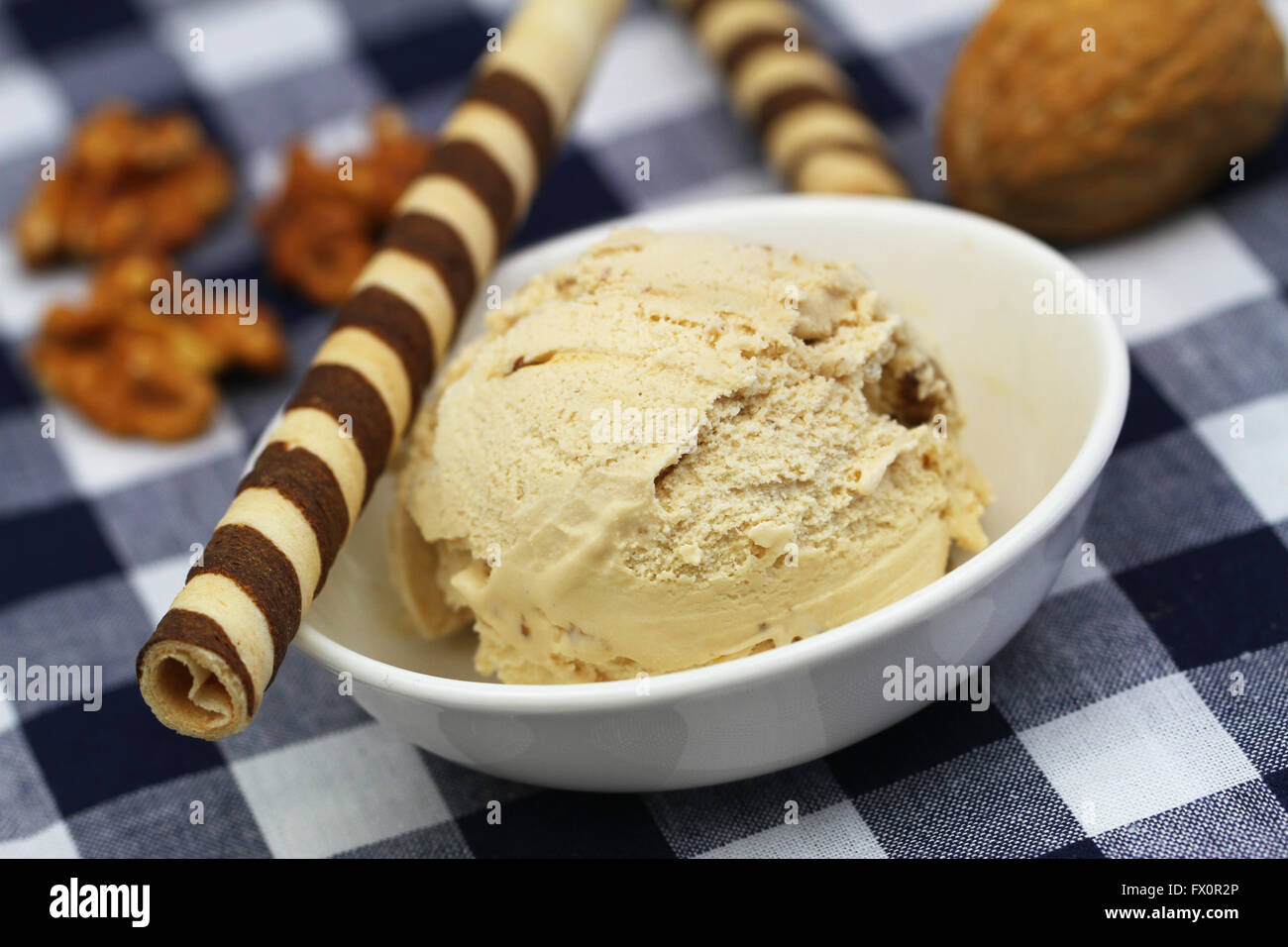 Walnut ice cream with chocolate wafers on checkered cloth Stock Photo ...