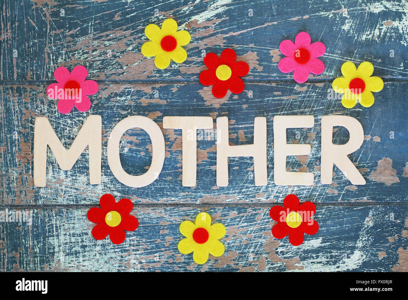 Word mother written with wooden letters on rustic surface with colorful ...