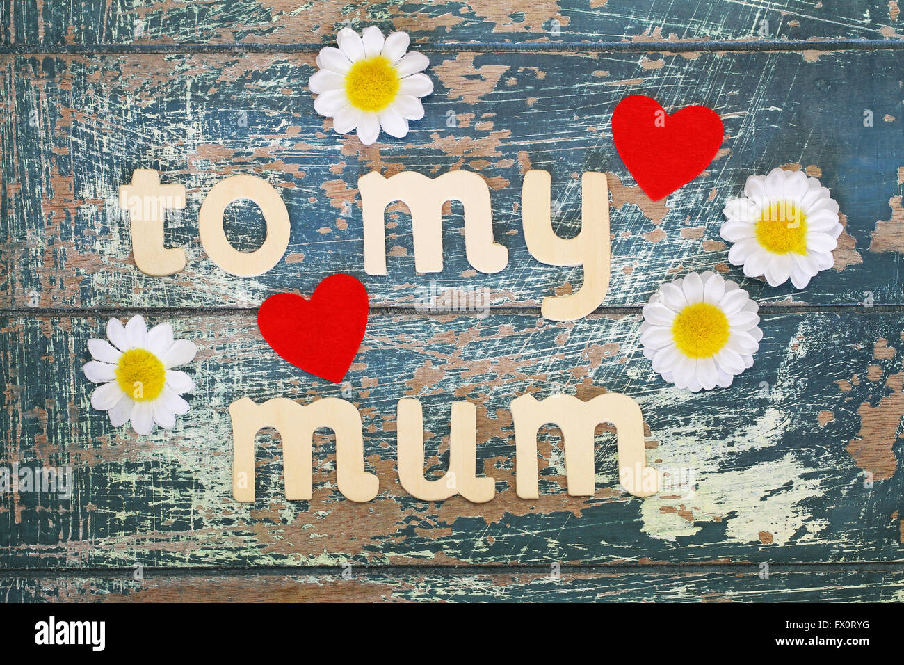 To my mum written with wooden letters on rustic surface with colorful ...