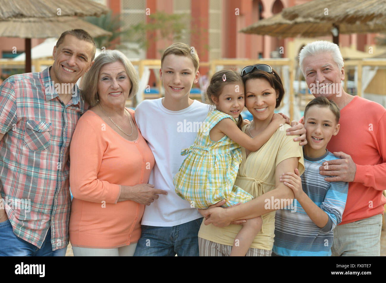 Family relaxing at resort Stock Photo - Alamy