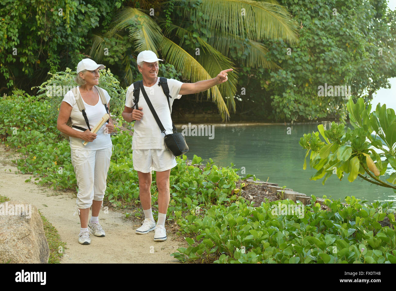 elderly couple rest at tropical resort Stock Photo - Alamy