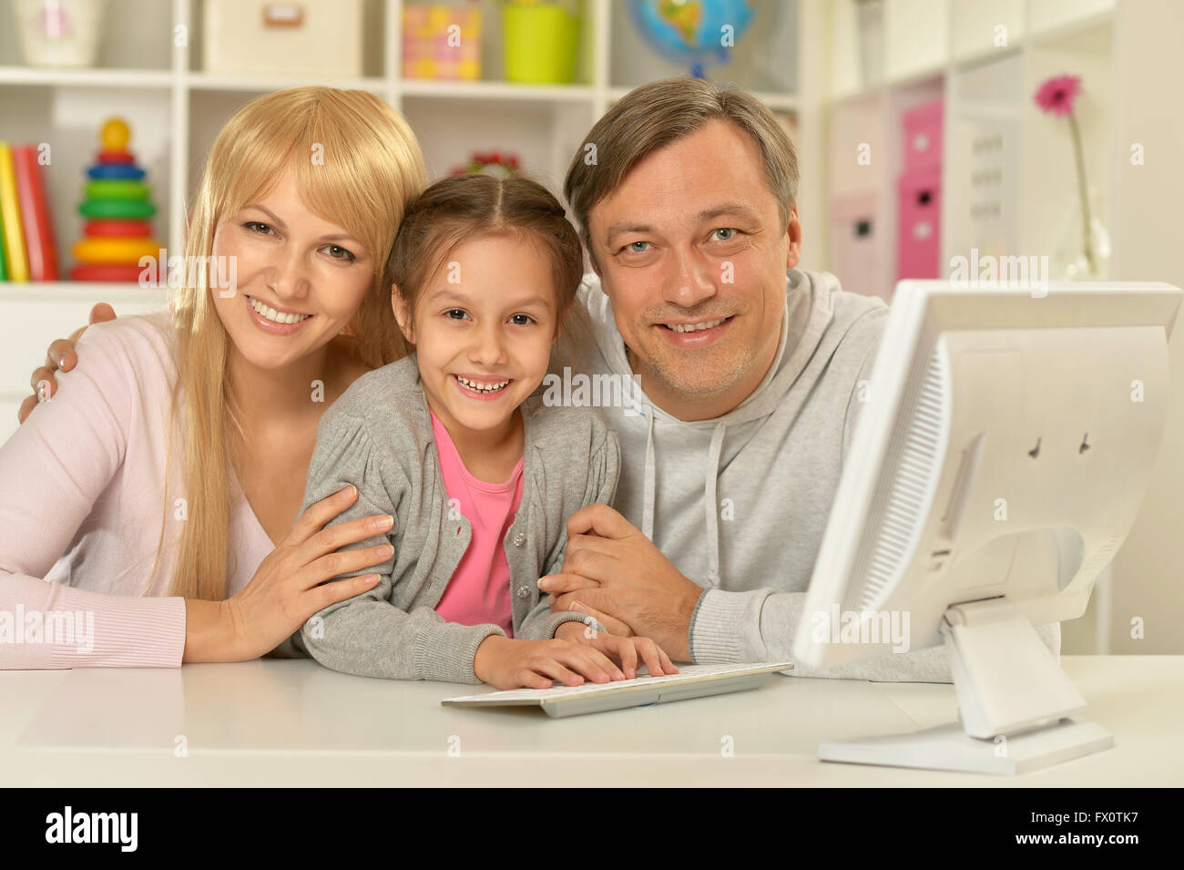 happy family with computer Stock Photo - Alamy