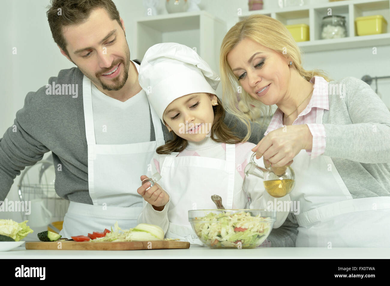 happy family cooking in kitchen Stock Photo - Alamy