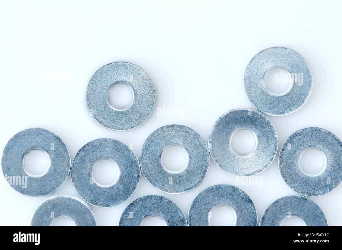 A lot of screw washers isolated on white background Stock Photo - Alamy