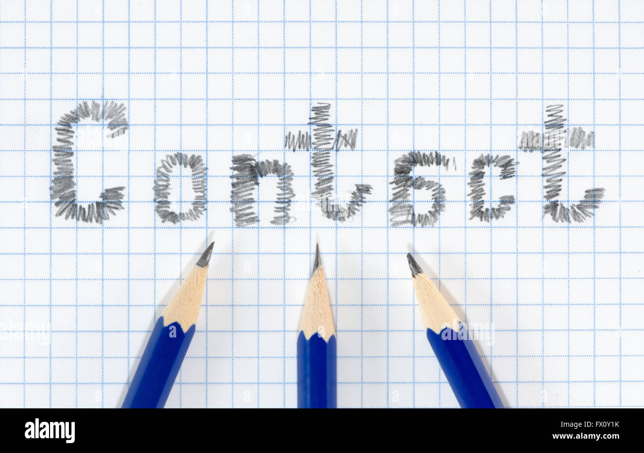 Business concept, contact word on square paper and three blue pencils ...