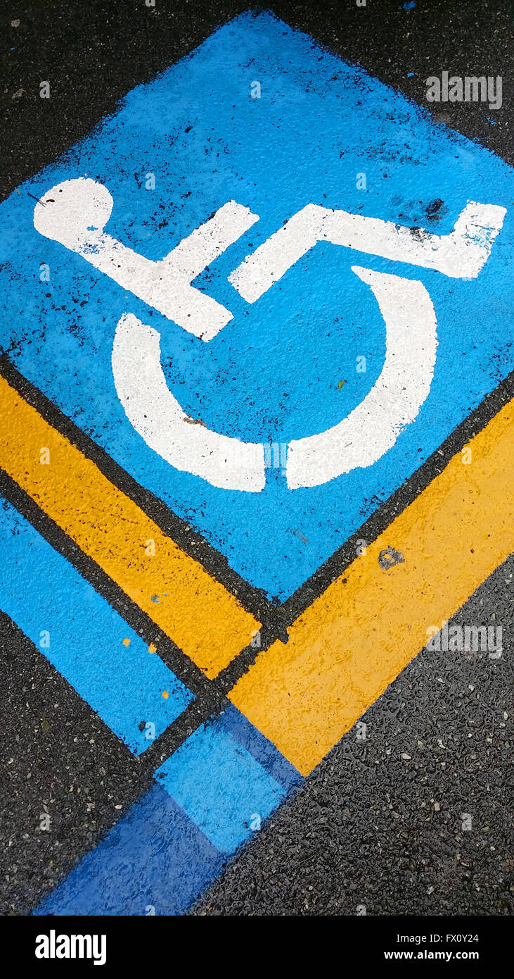 Symbol of the handicapped person painted on the asphalt Stock Photo - Alamy