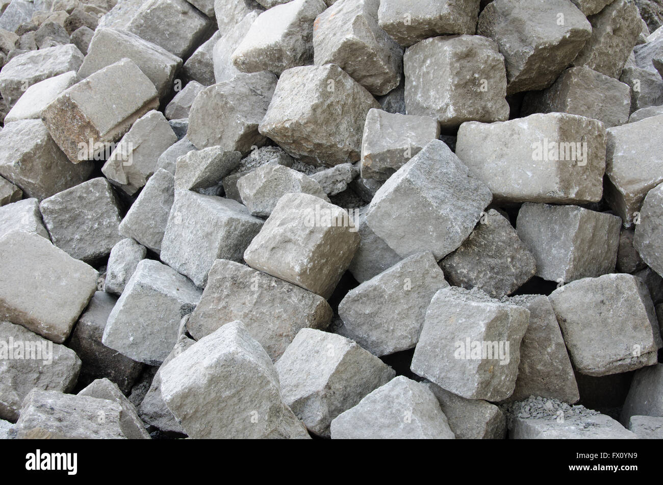 Dump of stone pavement blocks ready to use Stock Photo - Alamy