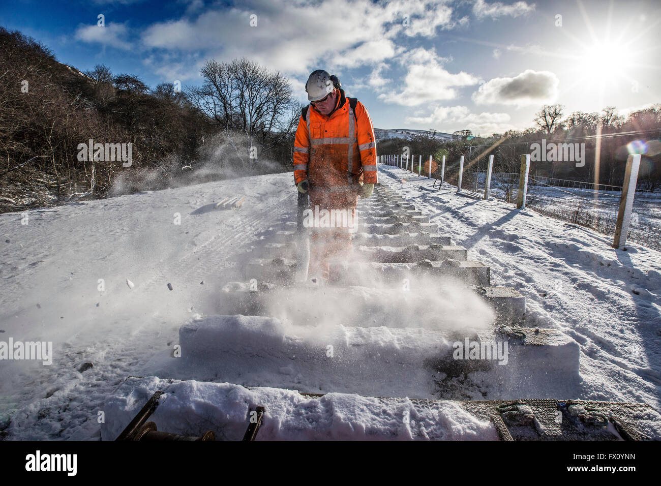 Snow blowing off track during Borders Railway Construction Stock Photo ...