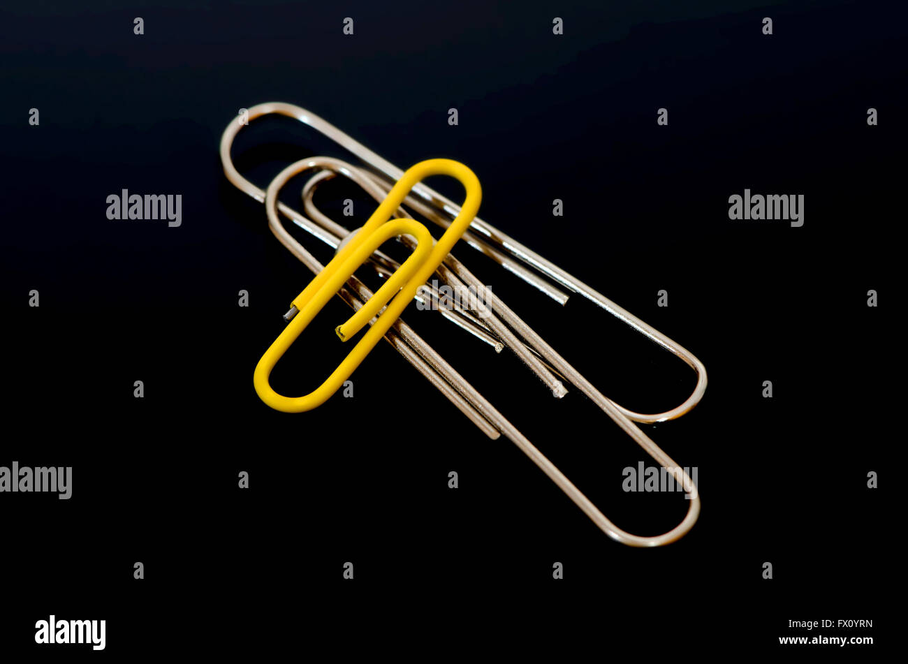 Office paper clips as singularity business concept Stock Photo - Alamy