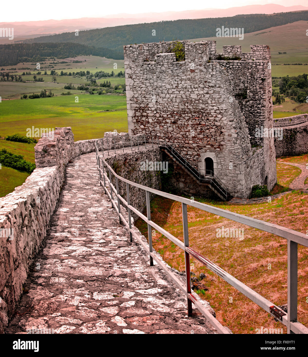 Gothic repaied stone castle tower and iron bainster Stock Photo - Alamy