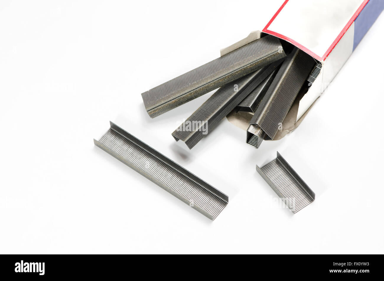 Stack of stapler's wires and paper box Stock Photo - Alamy