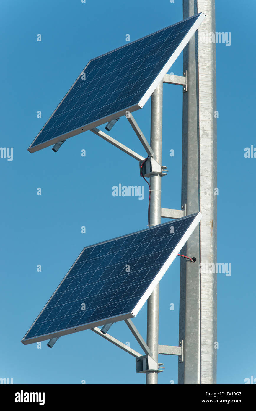 installation of two small solar panels Stock Photo - Alamy