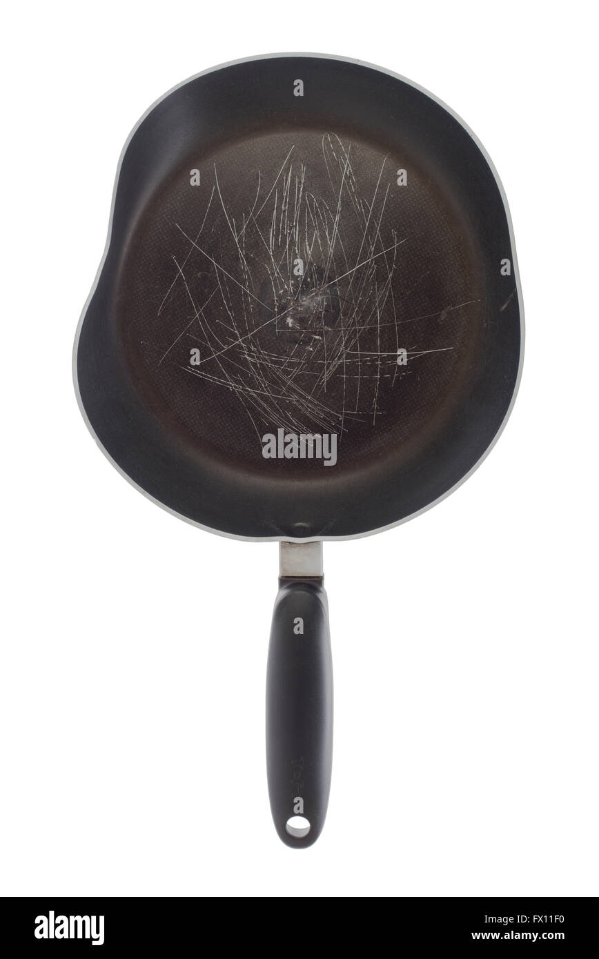 Broken old frying pan isolated on a white background Stock Photo - Alamy