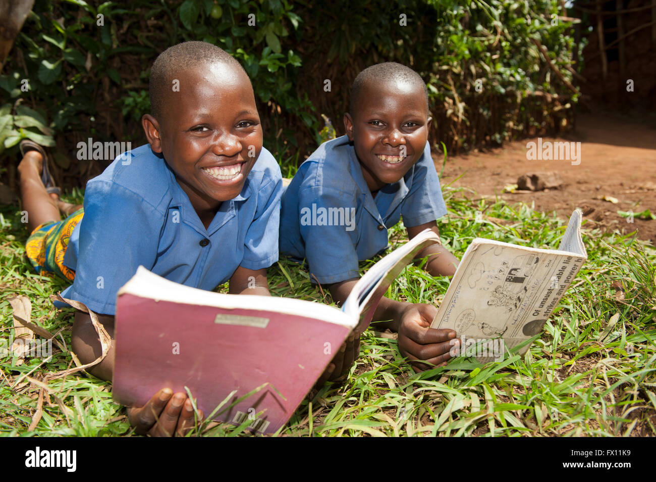 Smiling Rwandan children reading school books. Rwanda Stock Photo - Alamy