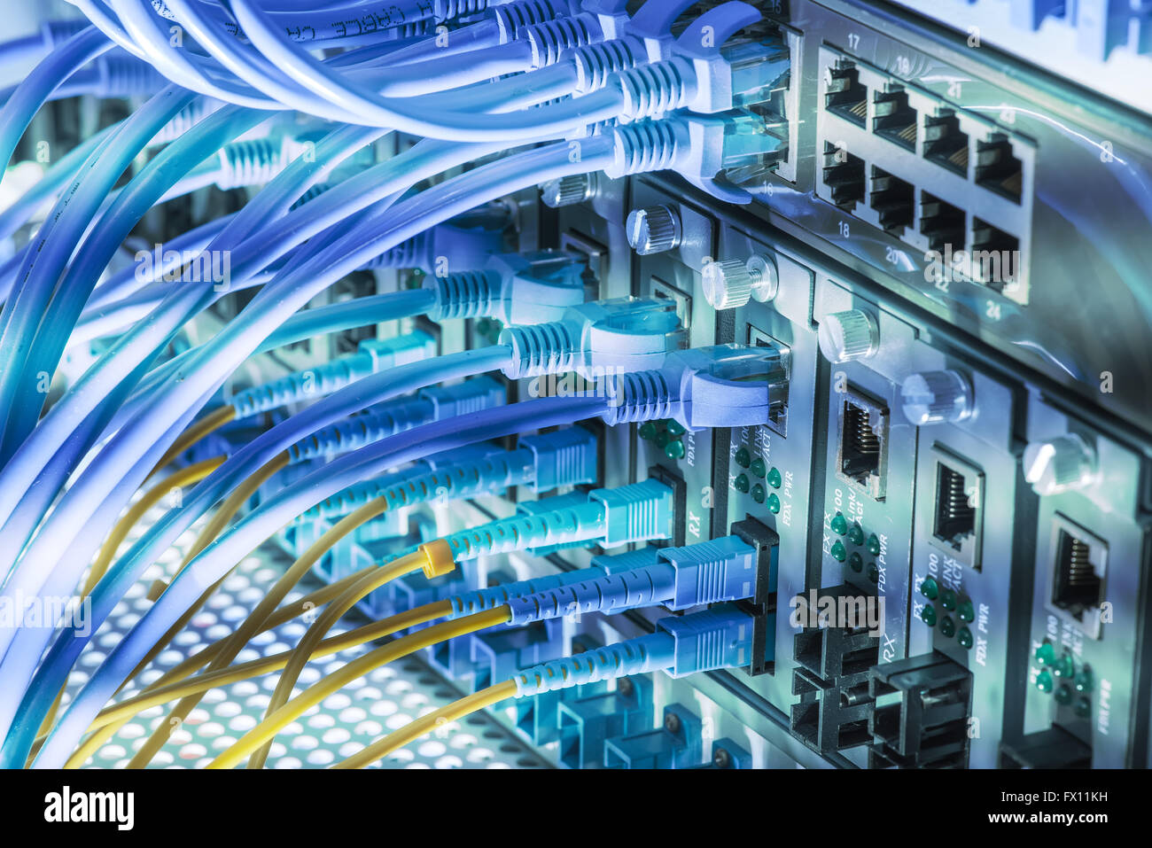 Fiber optic connecting on core network swtich Stock Photo - Alamy
