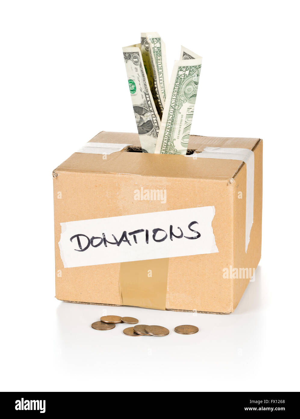 Donation carton box with dollar bills and coins over white background ...