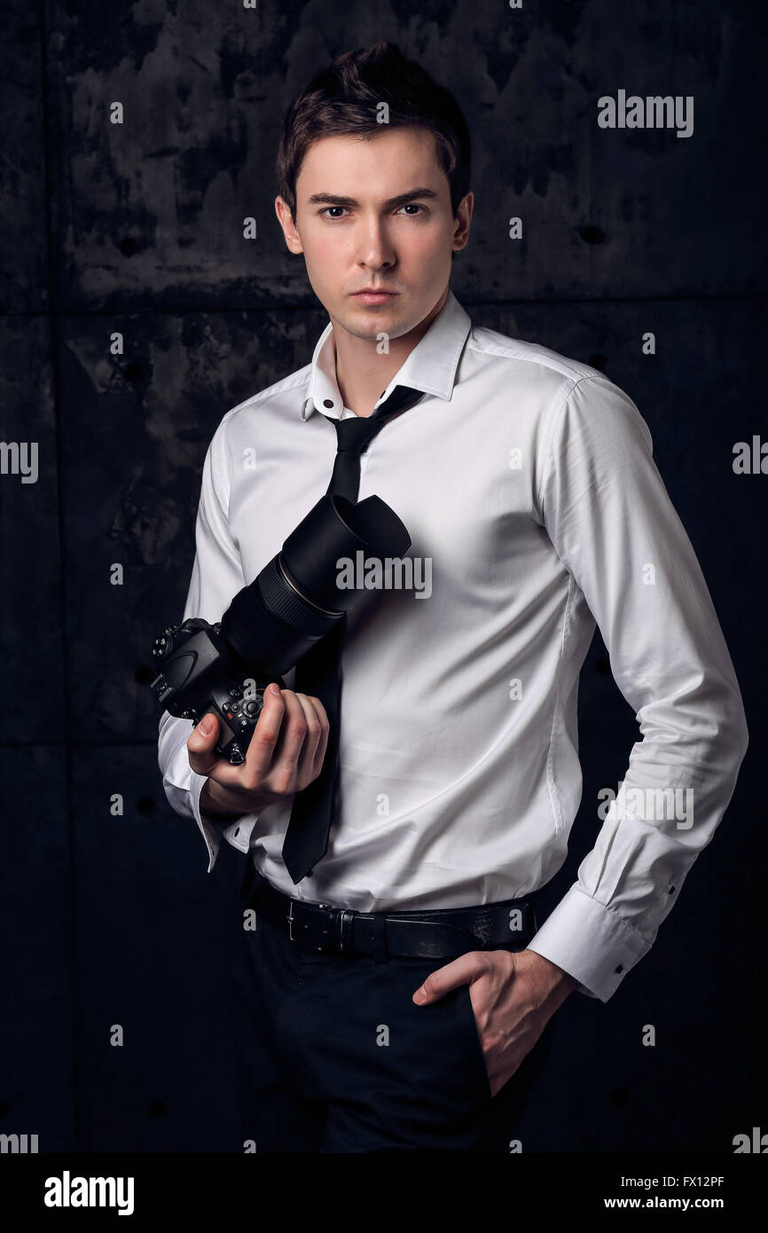 Portrait of Freelancer professional photographer on black Stock Photo ...