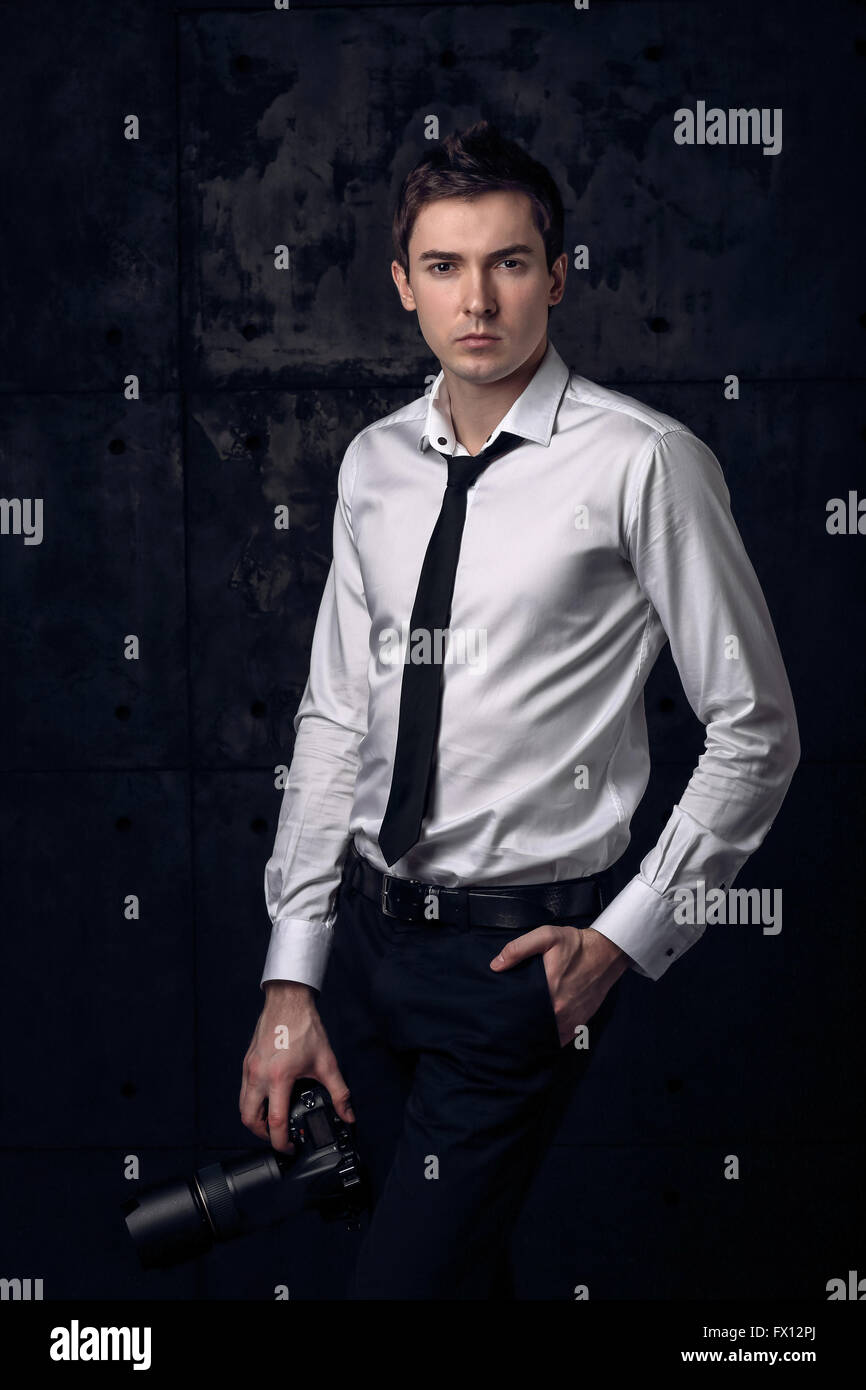 Portrait of Freelancer professional photographer on black Stock Photo - Alamy