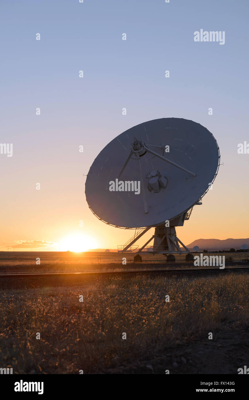 Sunset Huge antenna dish at Very Large Array, searching for imaging ...