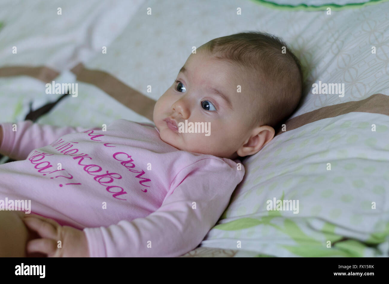 Baby girl with curiosity expression on her face Stock Photo - Alamy