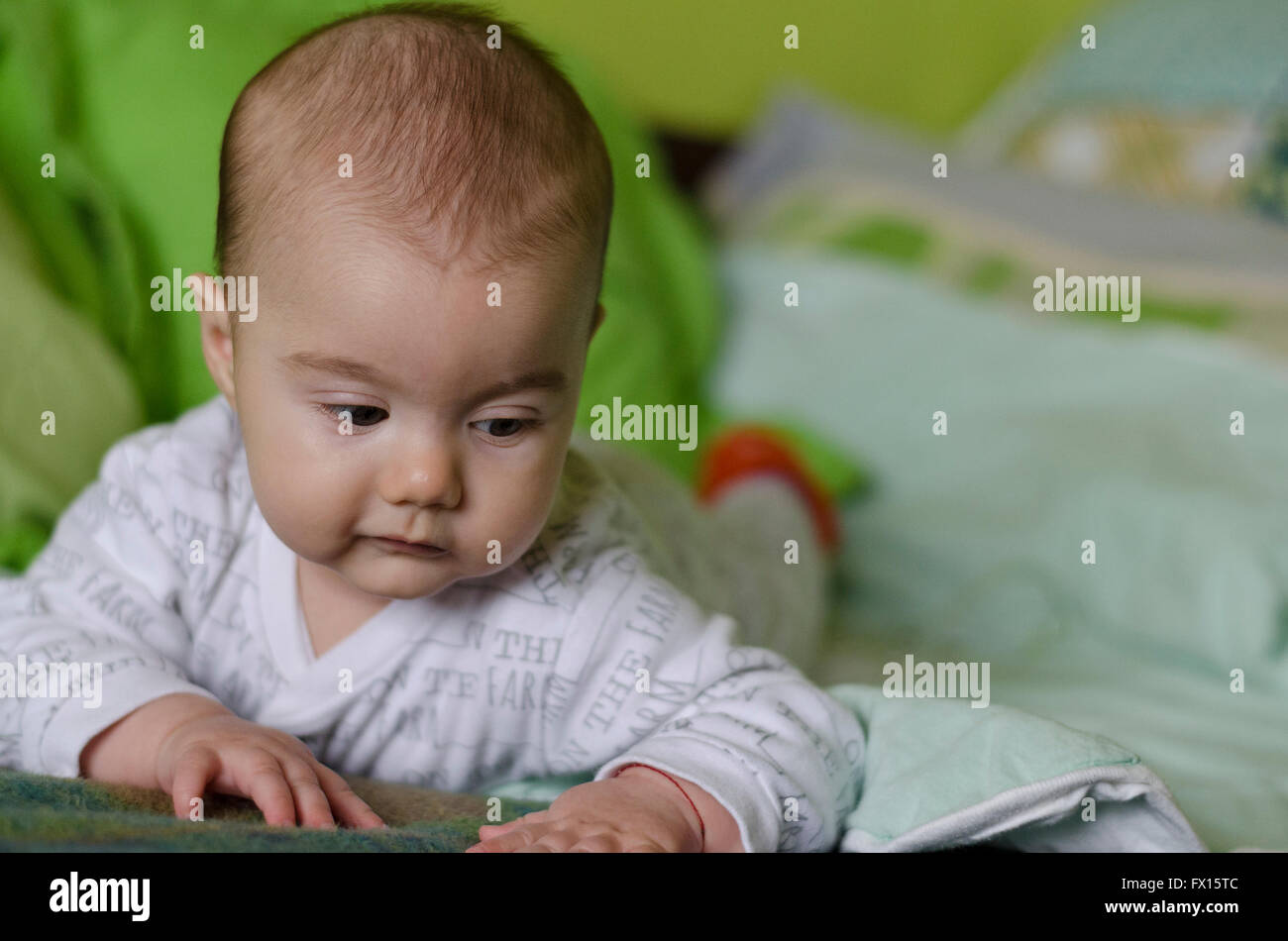 Baby girl with blue eyes learns to crawl Stock Photo - Alamy