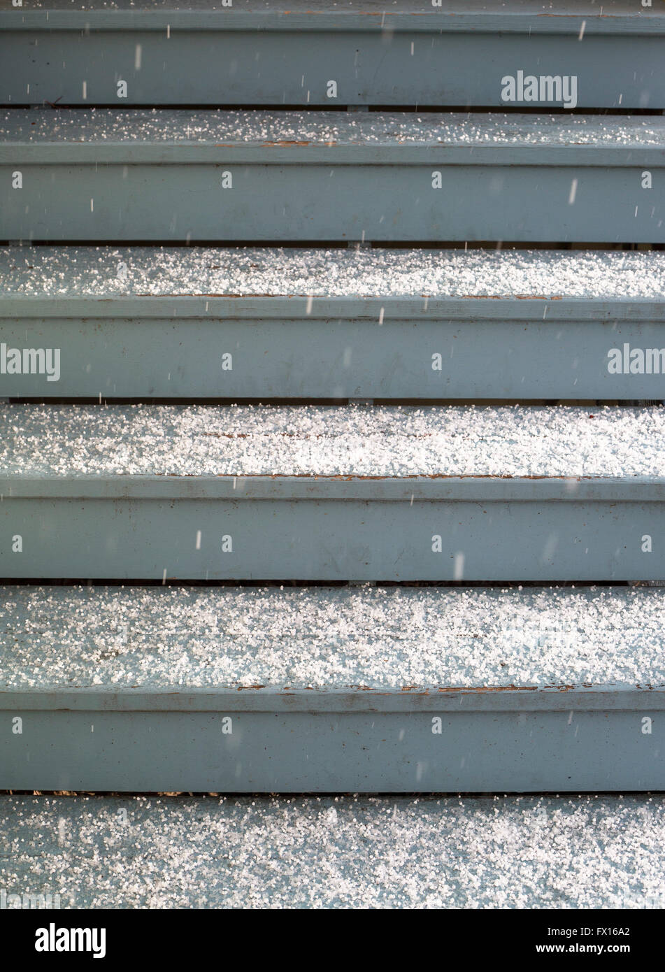 Hail falling and hail stones collecting on stairs during a hailstorm ...