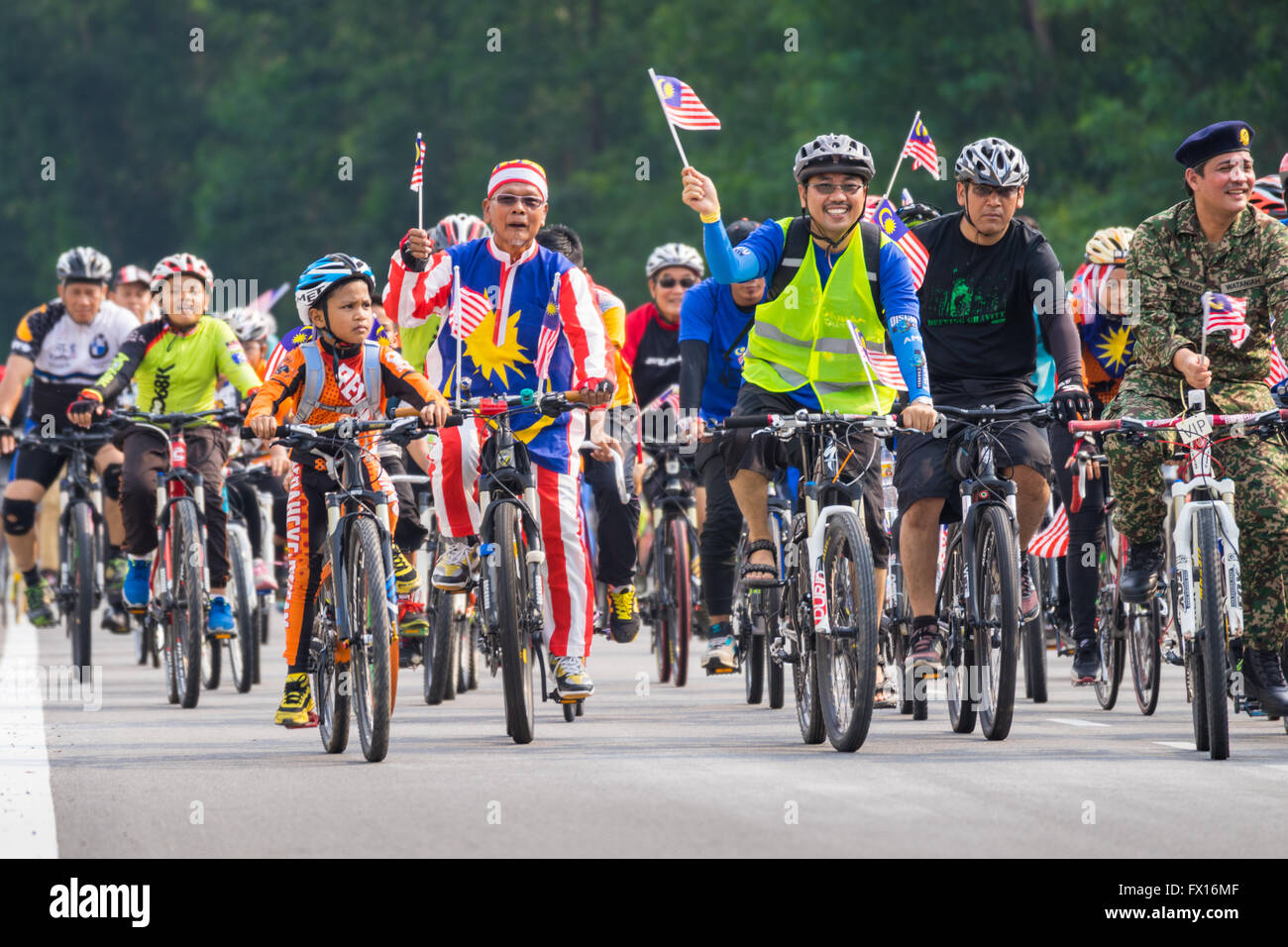 Bicycle ride during National Day celebration Stock Photo - Alamy