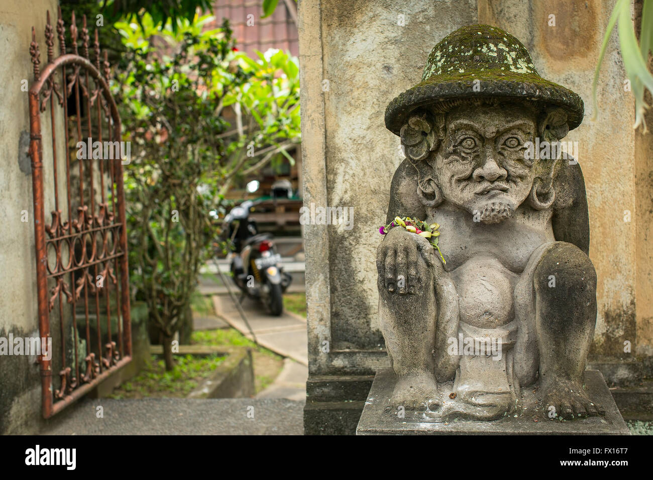 Traditional guard statue carved in stone on Bali island, Indonesia ...
