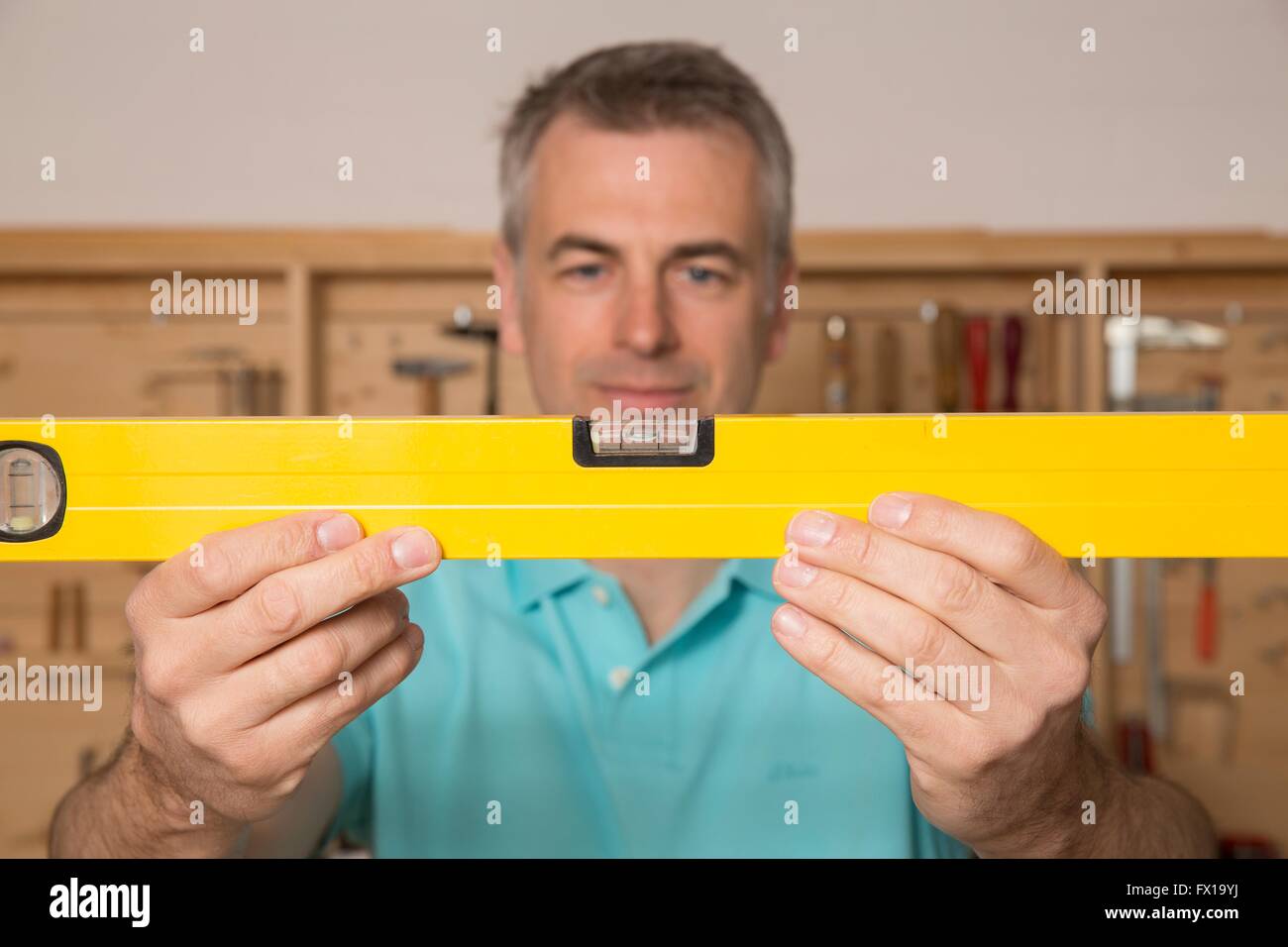 Spirit level man hi-res stock photography and images - Alamy