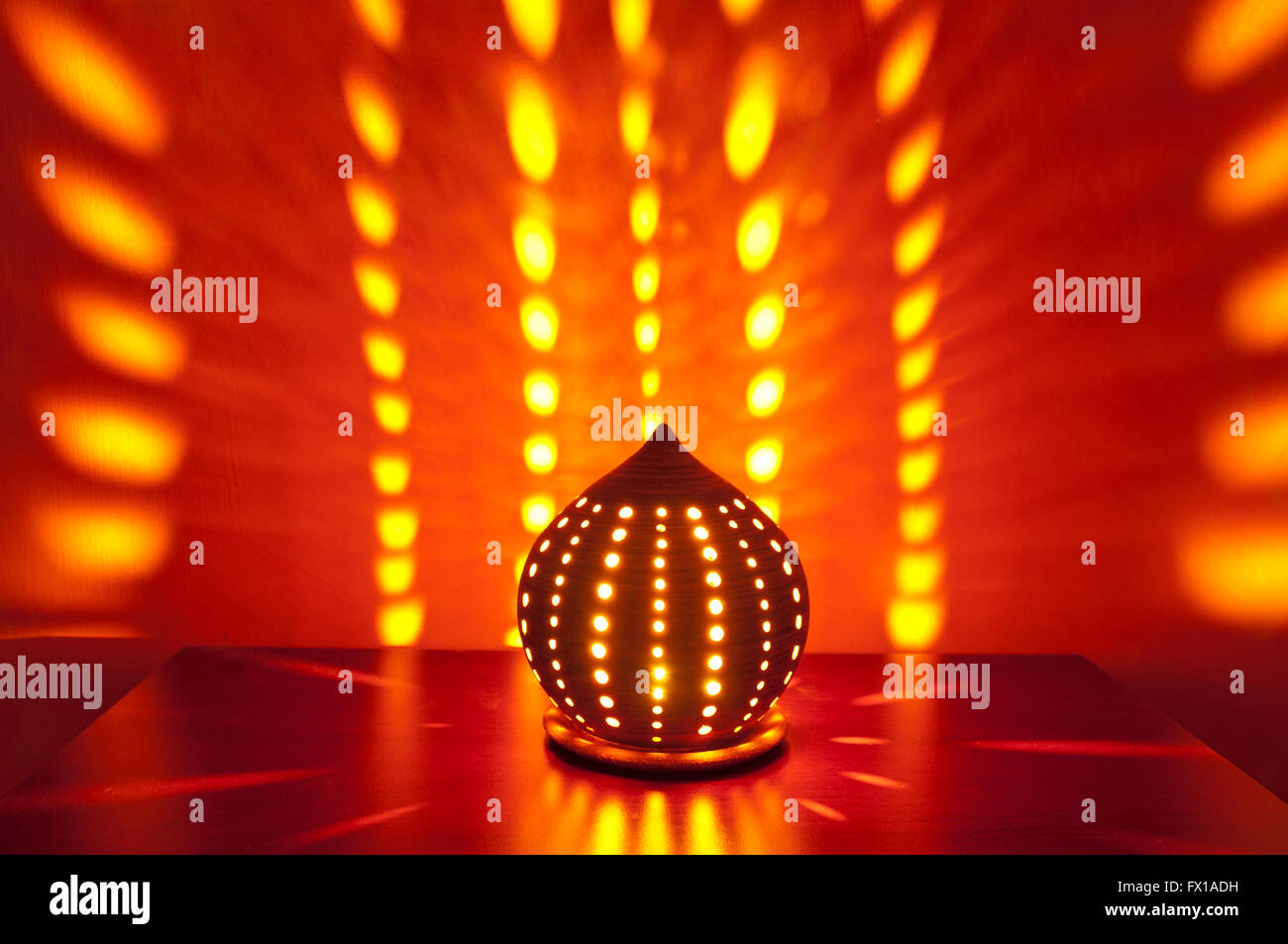 Traditional japanese lantern with candle inside showing patterns on the ...
