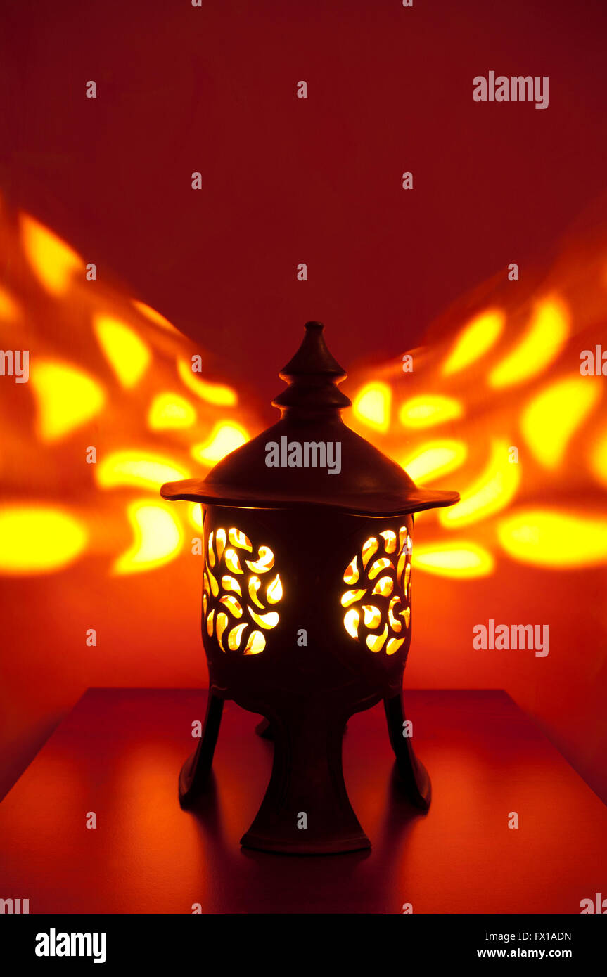 Traditional japanese lantern with candle inside showing patterns on the ...