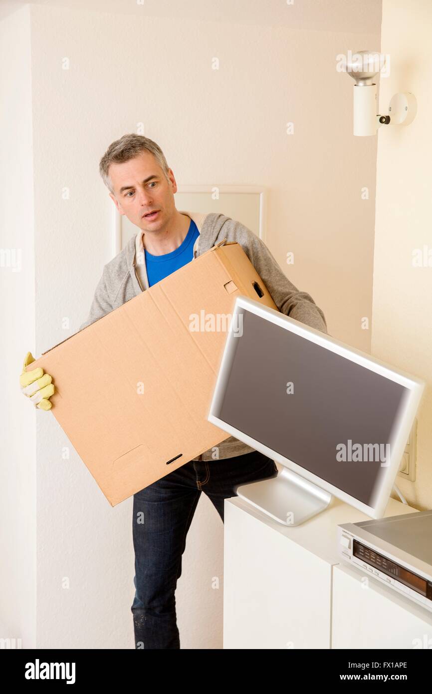 Man carrying computer screen hi-res stock photography and images - Alamy