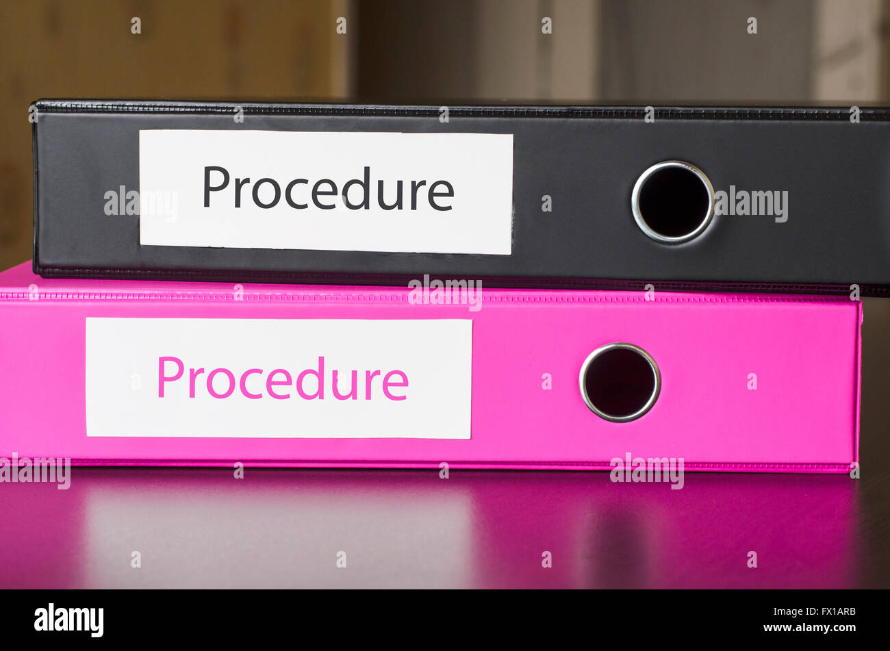 Bright office folders over dark background and procedure text concept ...