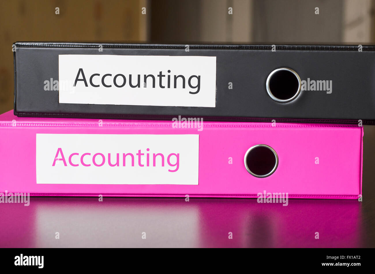 Bright office folders over dark background and accounting text concept ...