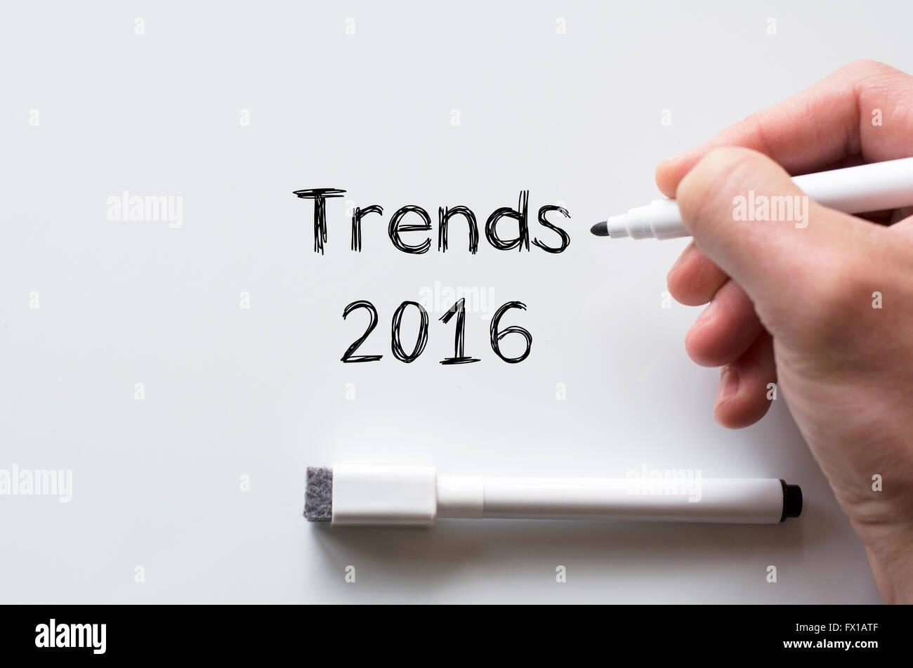 Human hand writing trends 2016 on whiteboard Stock Photo - Alamy