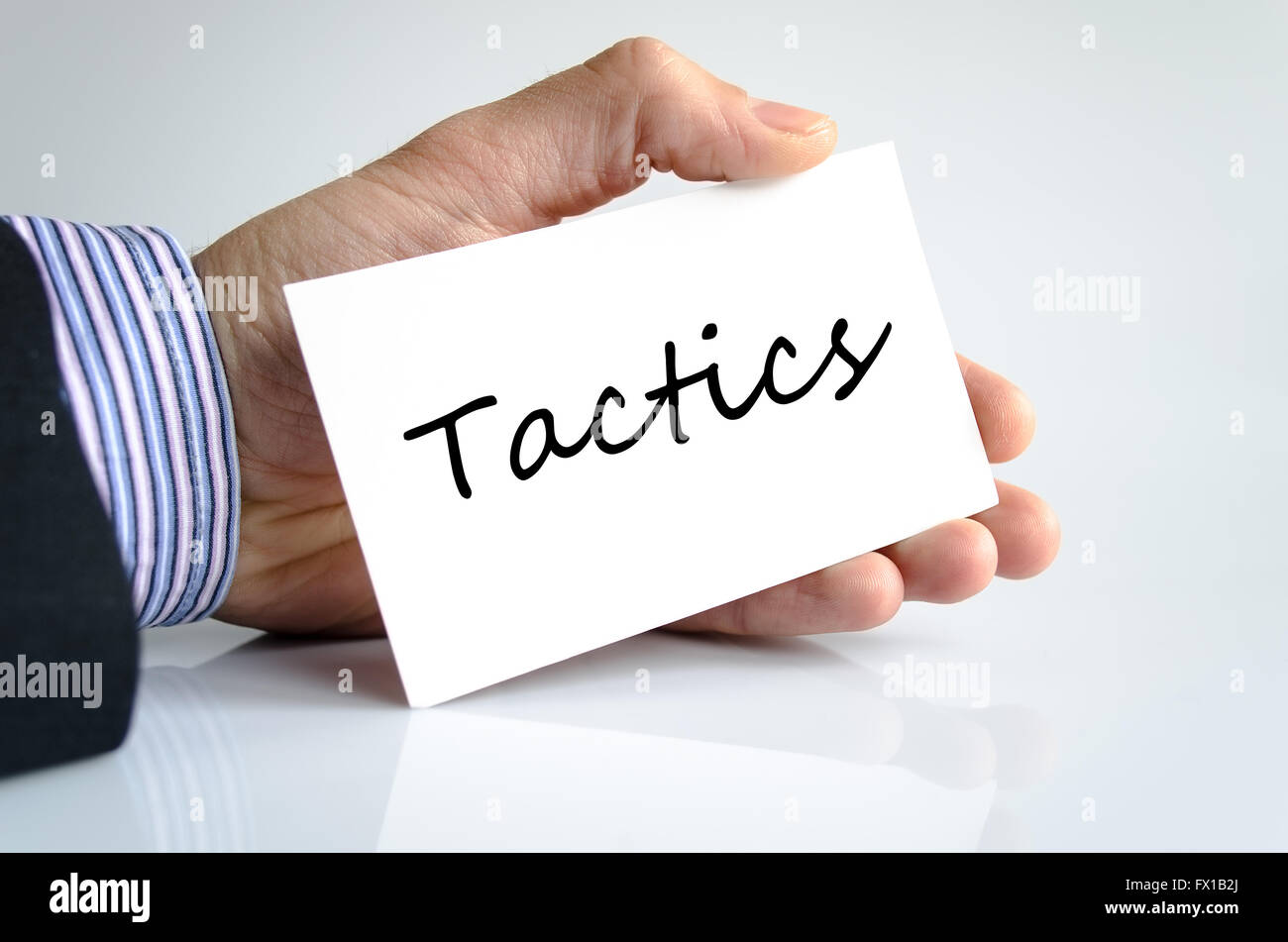 Tactics text concept isolated over white background Stock Photo - Alamy