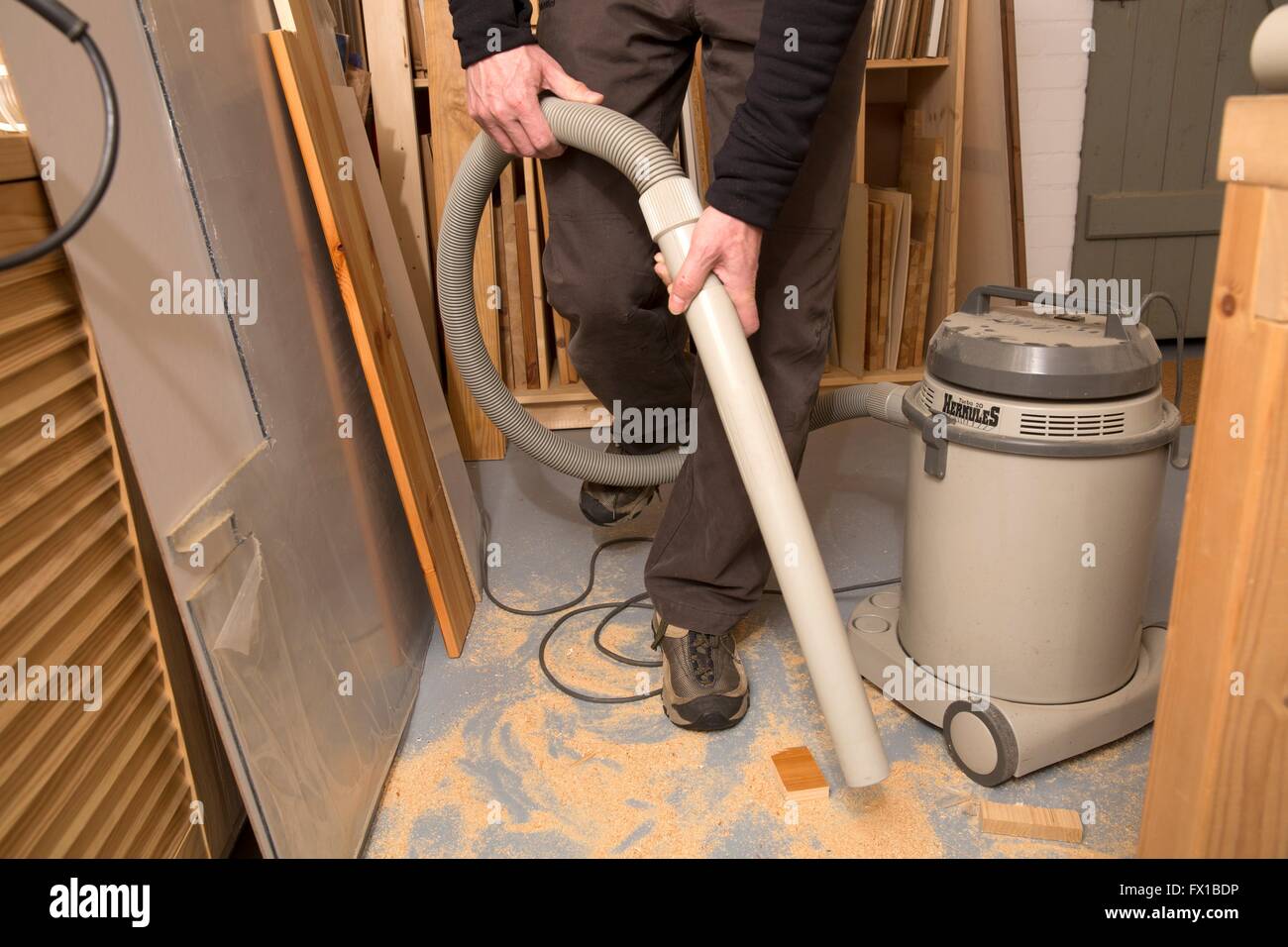 Man trips over a cable in the workshop Stock Photo - Alamy