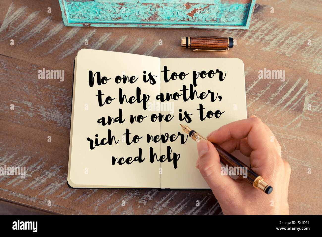 Retro effect and toned image of a woman hand writing on a notebook ...