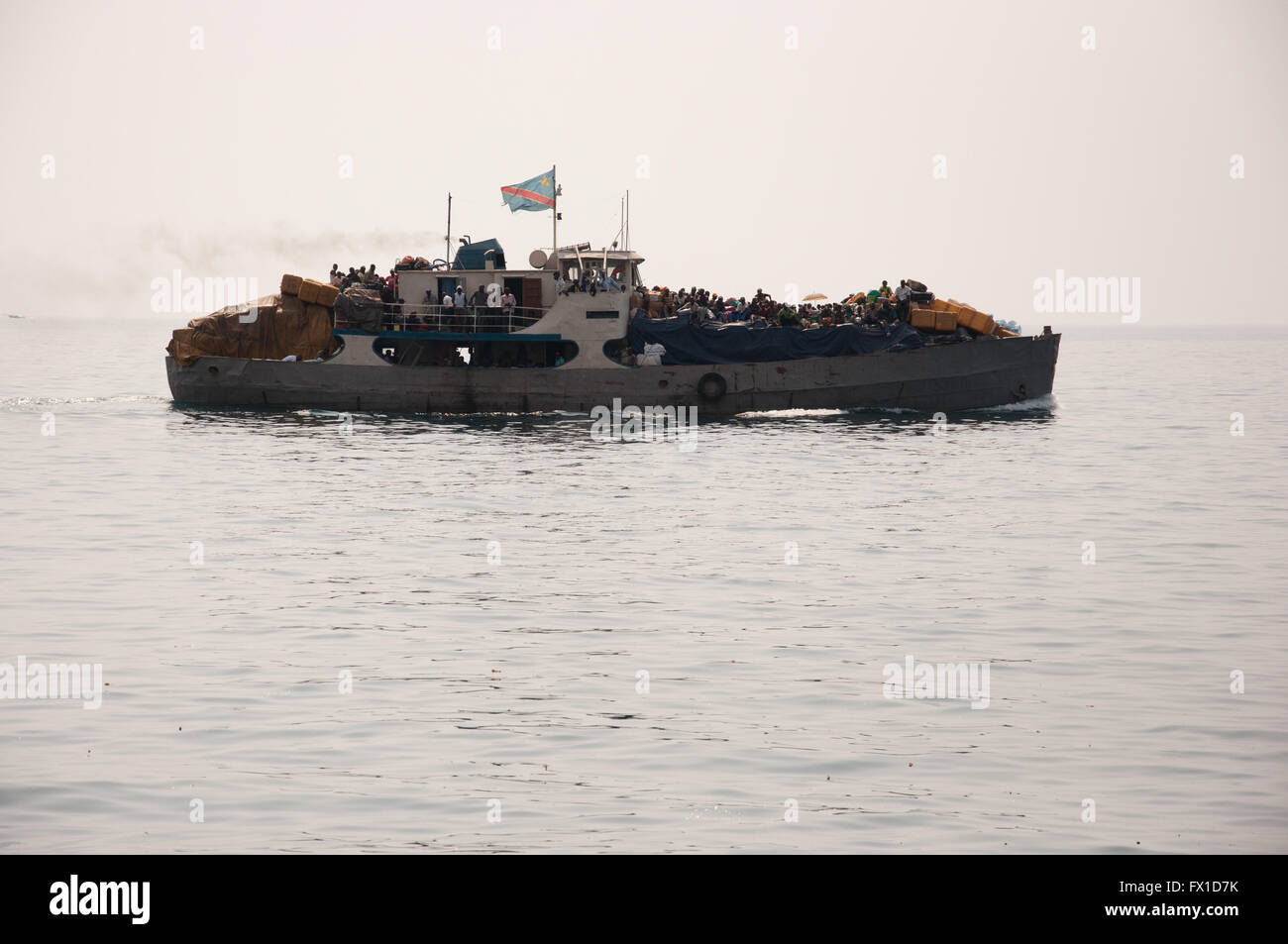A local ferry departs Uvira, Democratic Republic of the Congo,on the ...