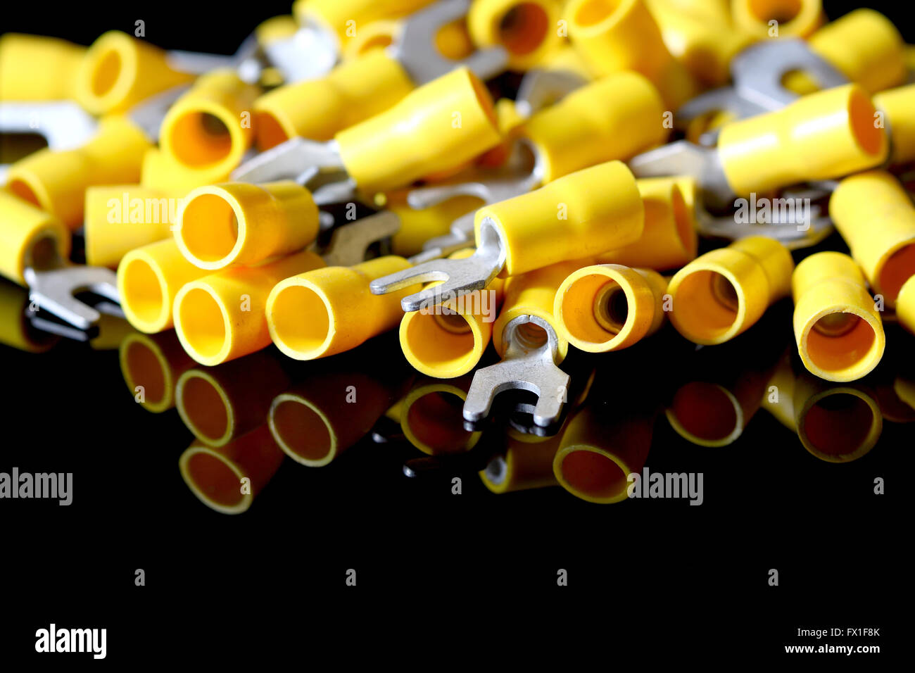 Electric terminals reflected on black background Stock Photo - Alamy