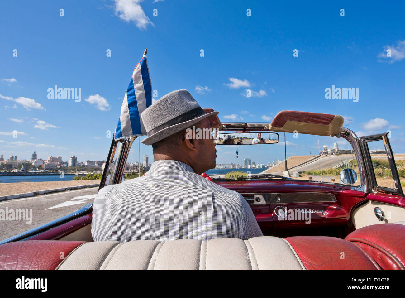 Horizontal view of the coastal road from inside a classic American car ...