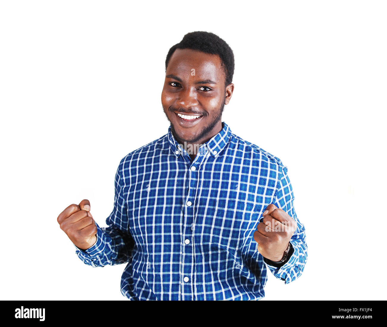A handsome young black man in a colorful shirt and stretched out arms ...