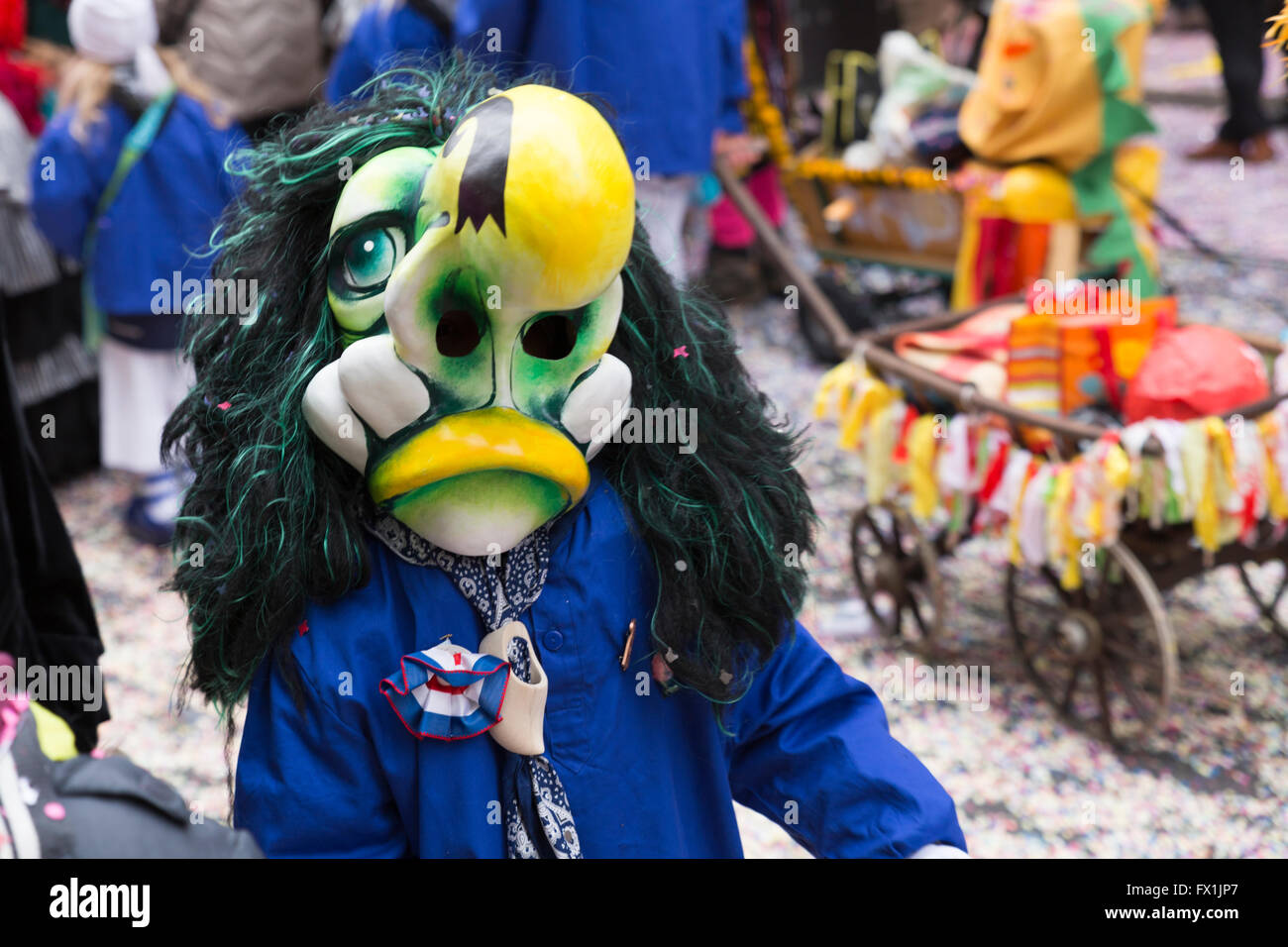 One participant of the Basel carnival 2016 in a so called Waggis ...