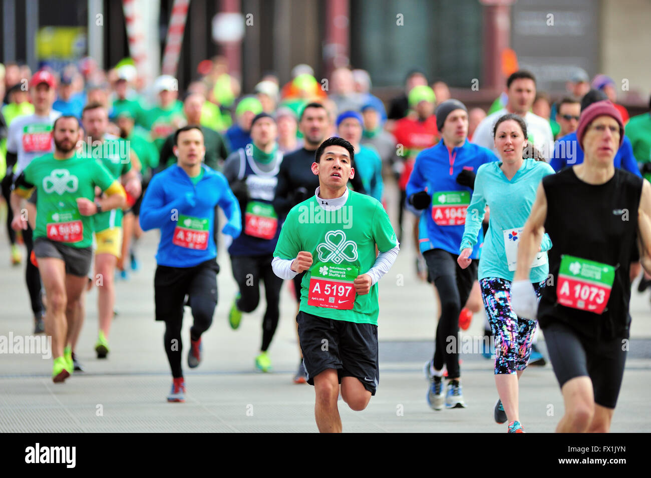 A cluster of runners as they cross the State Street Bridge at about the ...