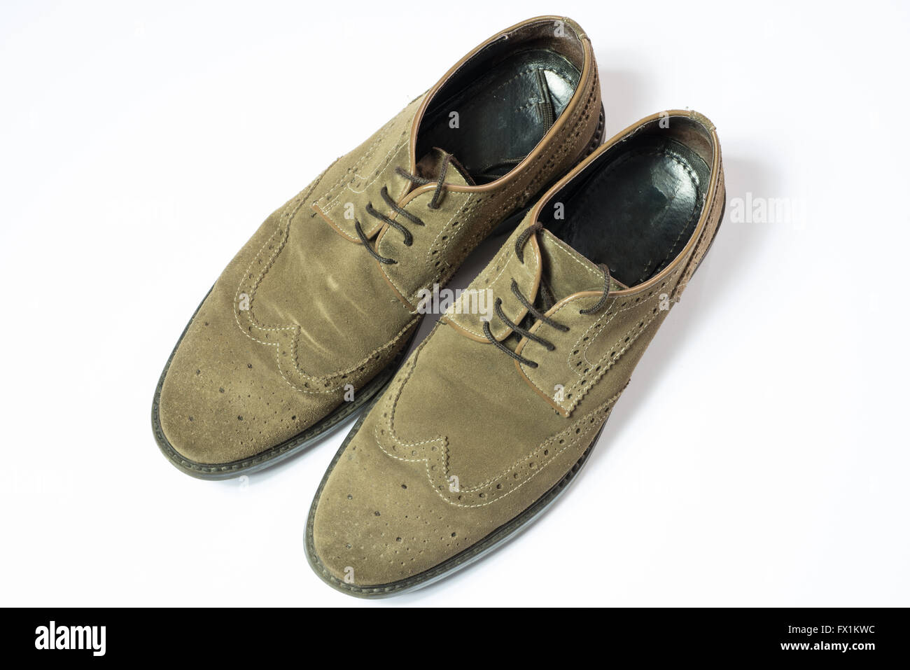 brown used budapester suede shoes on white background Stock Photo - Alamy