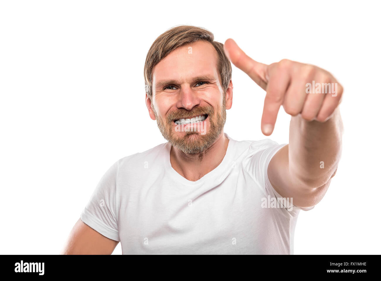 Smiling man points down to an empty space.. Isolated on white Stock ...