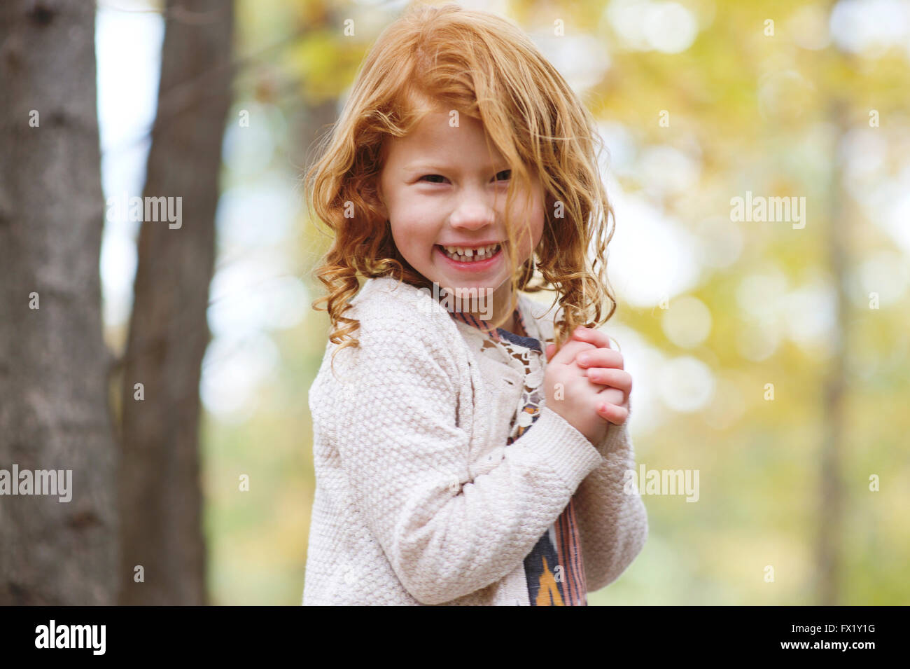 Red headed girl laughing at the park Stock Photo - Alamy