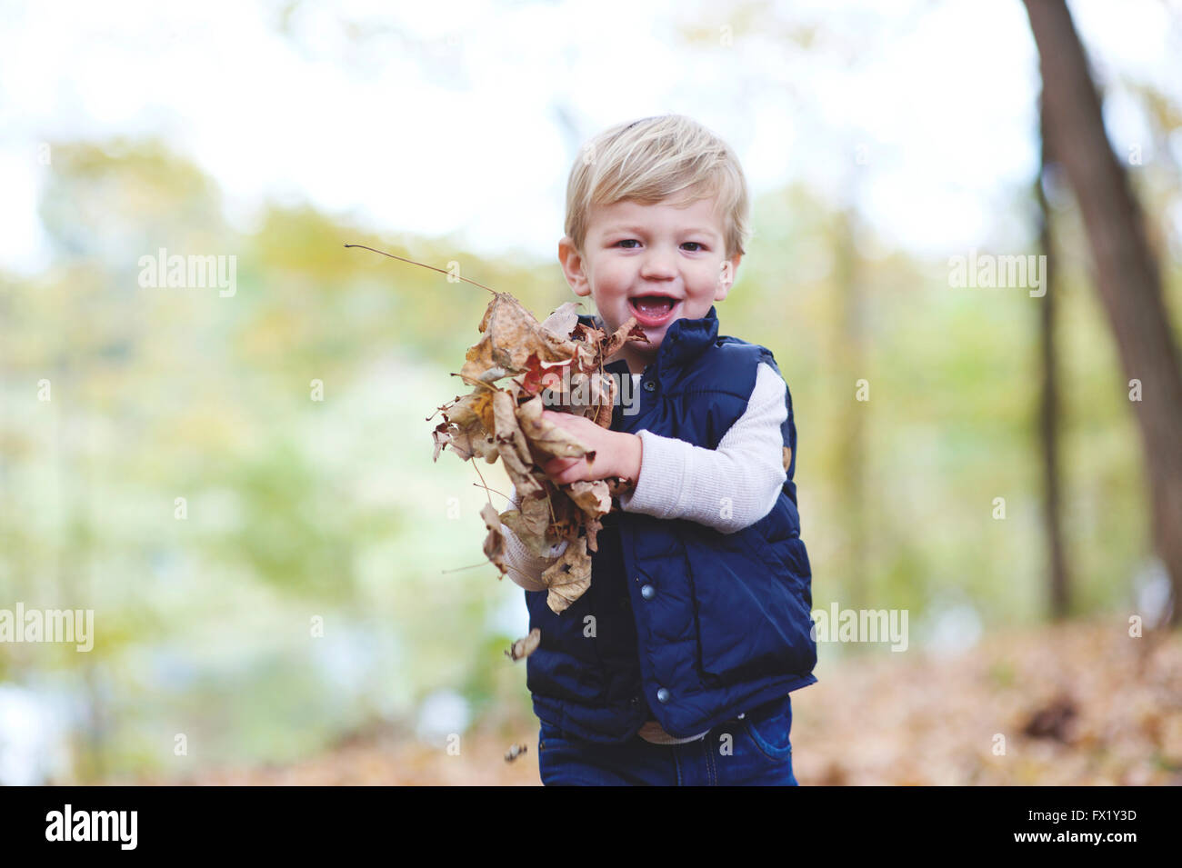 Boy leaves hi-res stock photography and images - Alamy