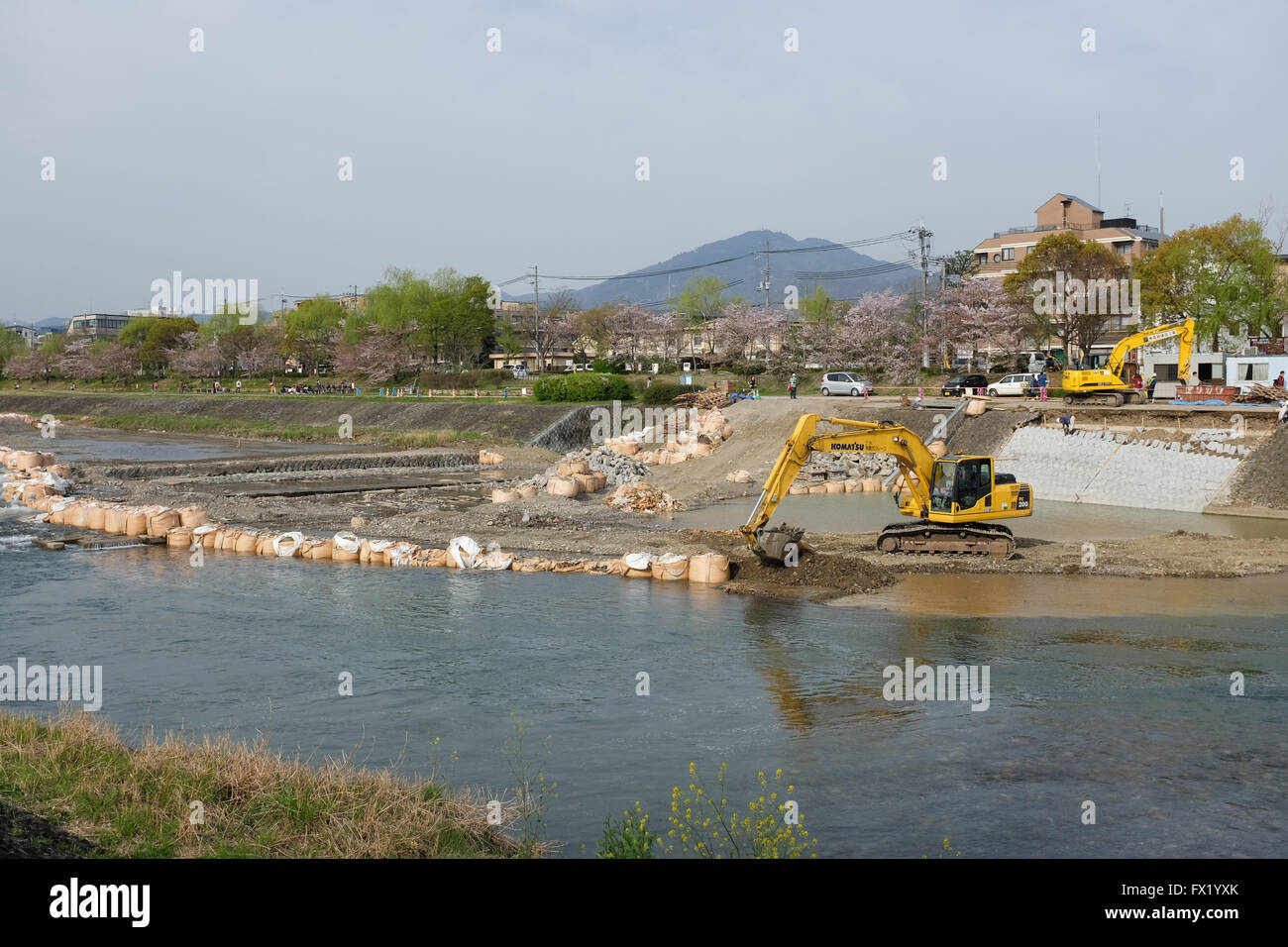 A digger working in Kyoto's Kamo River (Kamogawa) in Japan Stock Photo ...