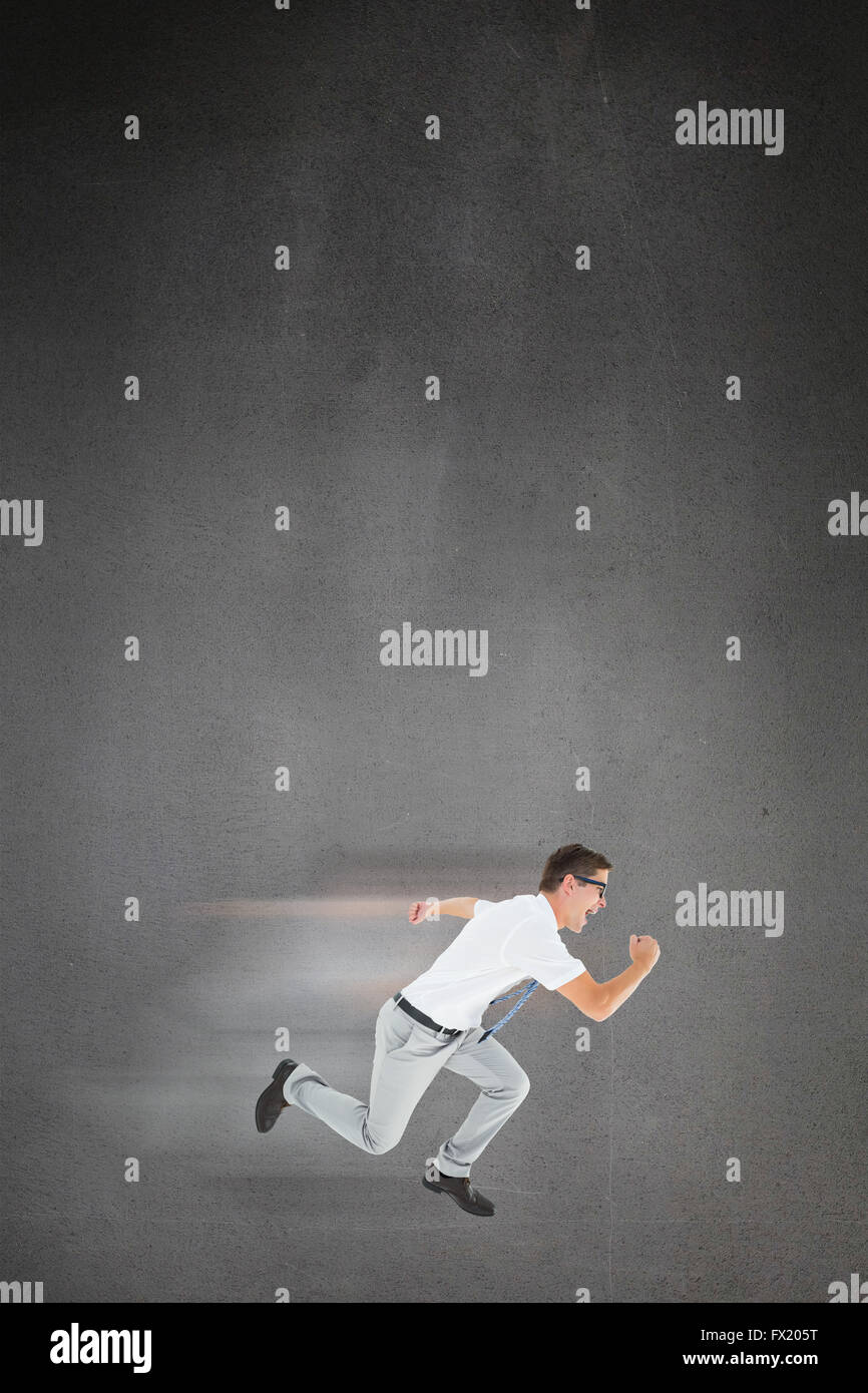 Composite image of geeky happy businessman running mid air Stock Photo ...